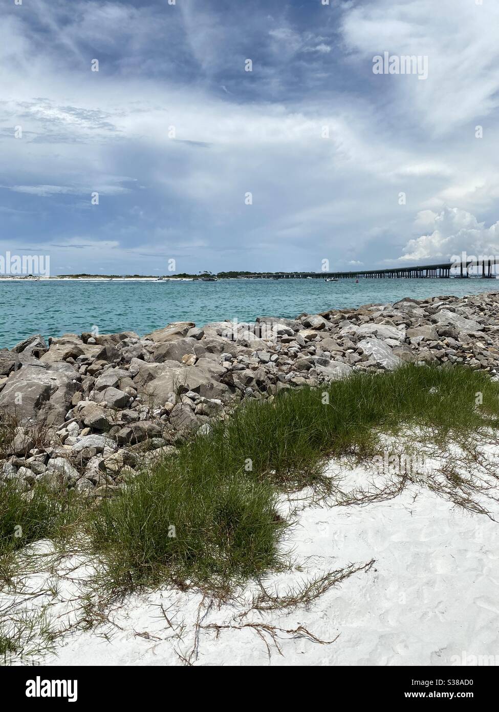 Rocky shoreline with view of Destin bridge at Norriego Point Florida ...