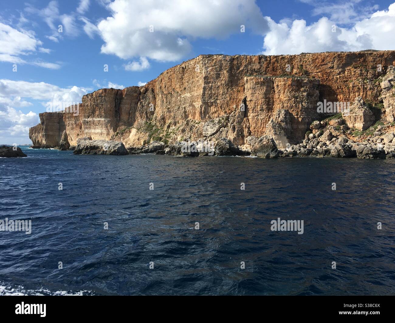 Blue ocean brown cliffs white sky hi-res stock photography and images ...