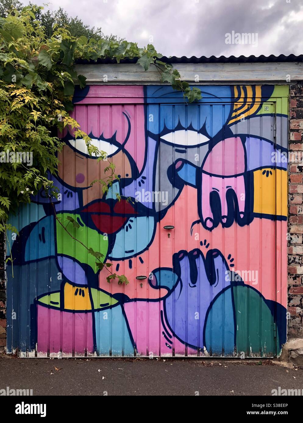 Graffiti on a garage door in Hackney, London UK Stock Photo - Alamy