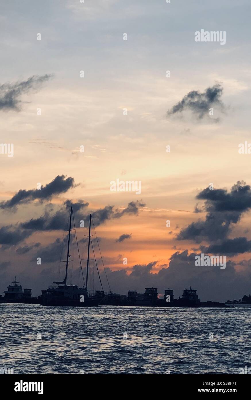 Without editing Sky sunset colours at maldives Stock Photo - Alamy