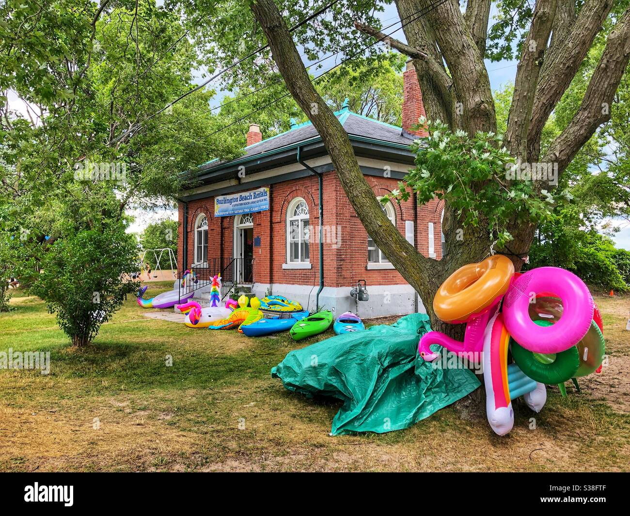 Beach rentals, flotation devices Stock Photo - Alamy
