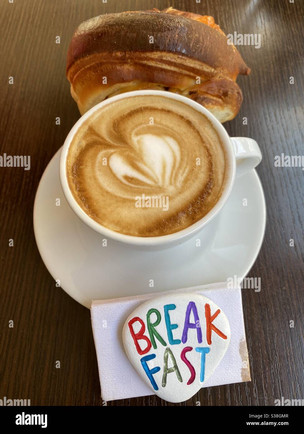 Typical italian breakfast at the bar with croissant and cappuccino ...