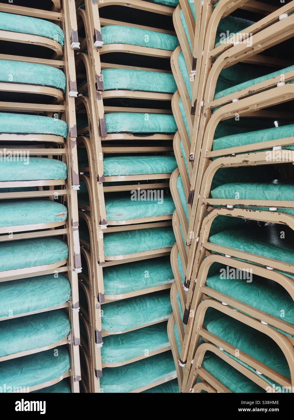 Vertical stacked chairs Stock Photo - Alamy