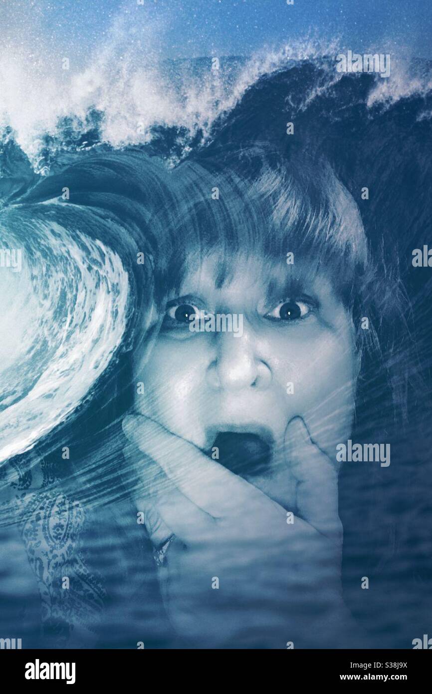 Conceptual image of female inside extremely turbulent ocean wave ...