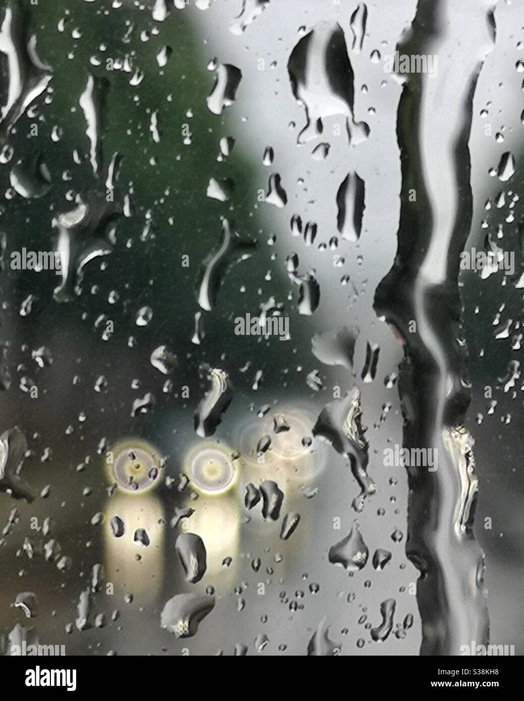 Car headlights refracted through rainy window Stock Photo - Alamy