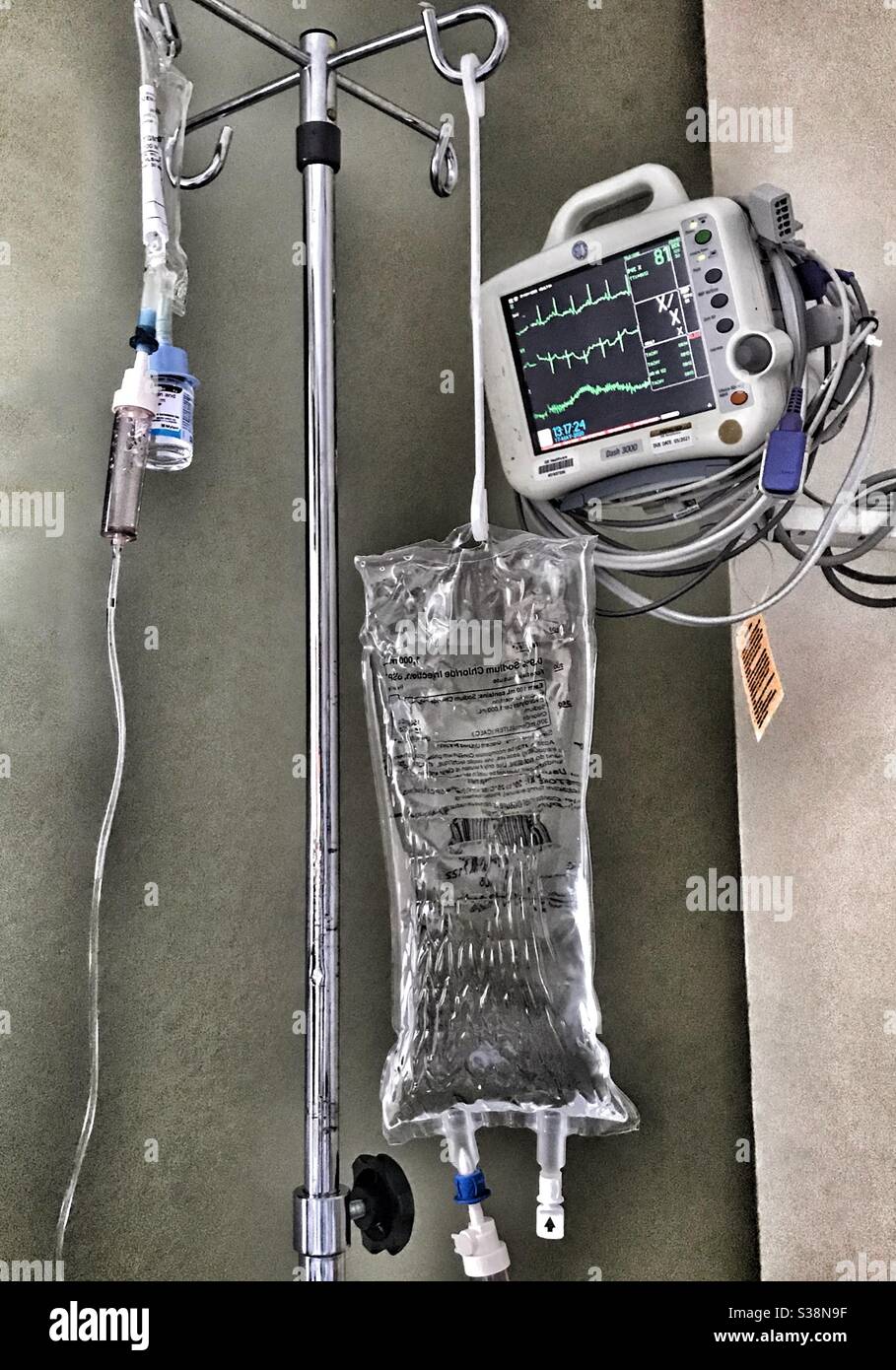 In the hospital, IV pole and drip in foreground , telemetry box in ...