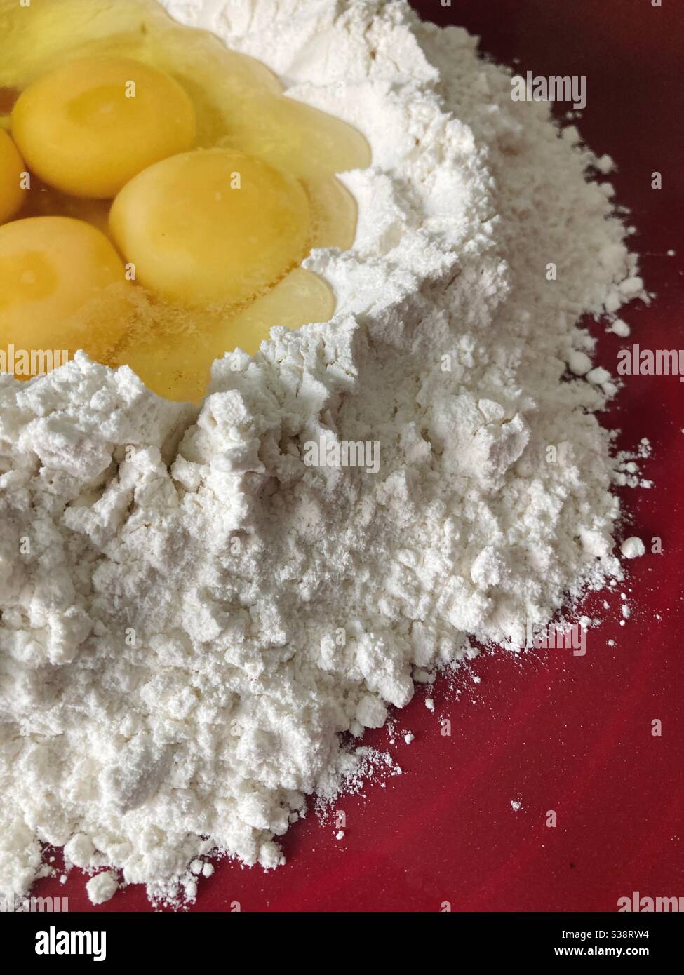 Making fresh pasta-eggs and flour Stock Photo - Alamy