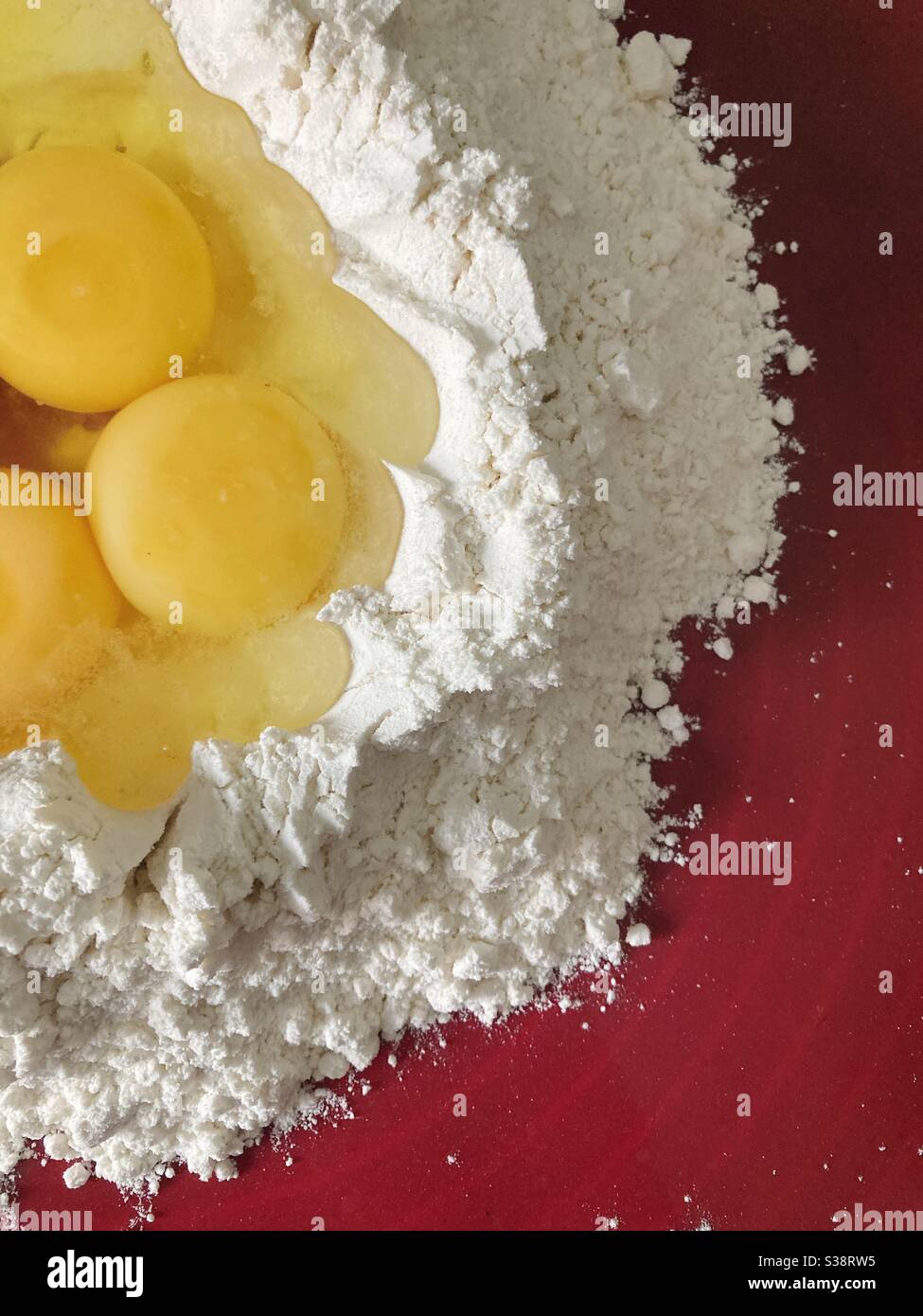 Making fresh pasta-eggs and flour Stock Photo - Alamy