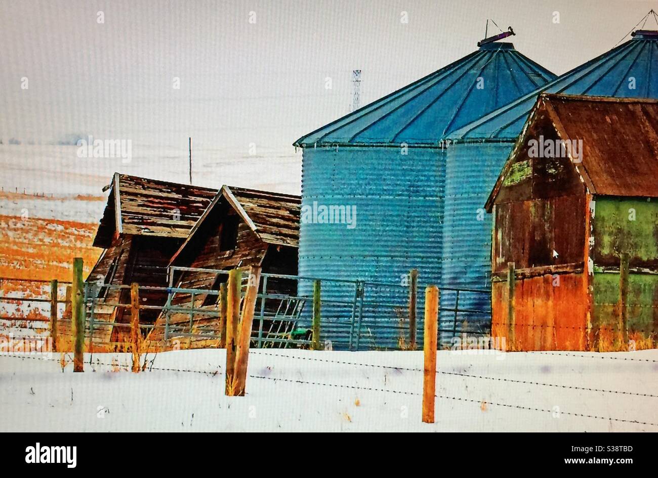 Three old granaries, old, sagging, leaning, tipping, need proving up ...