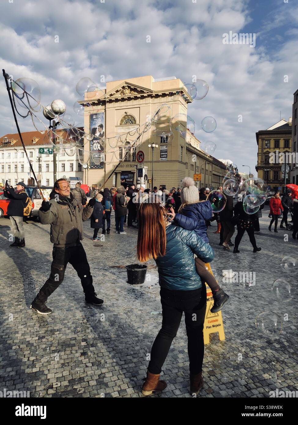 A candid of bubble blower in the middle of Prague city in Czech ...