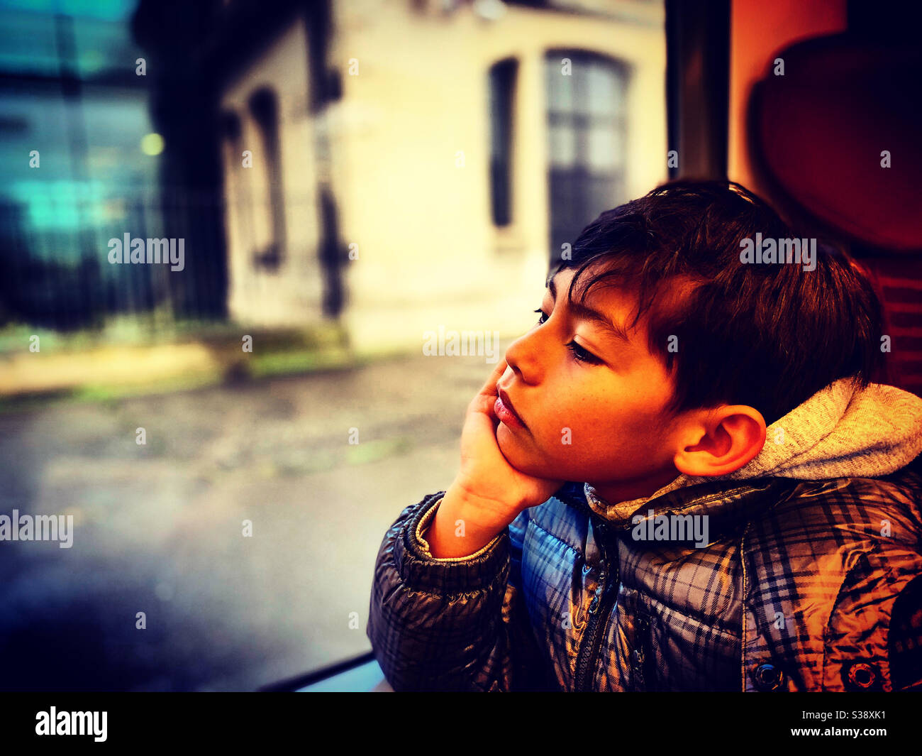 bored little boy in a public transport Stock Photo - Alamy