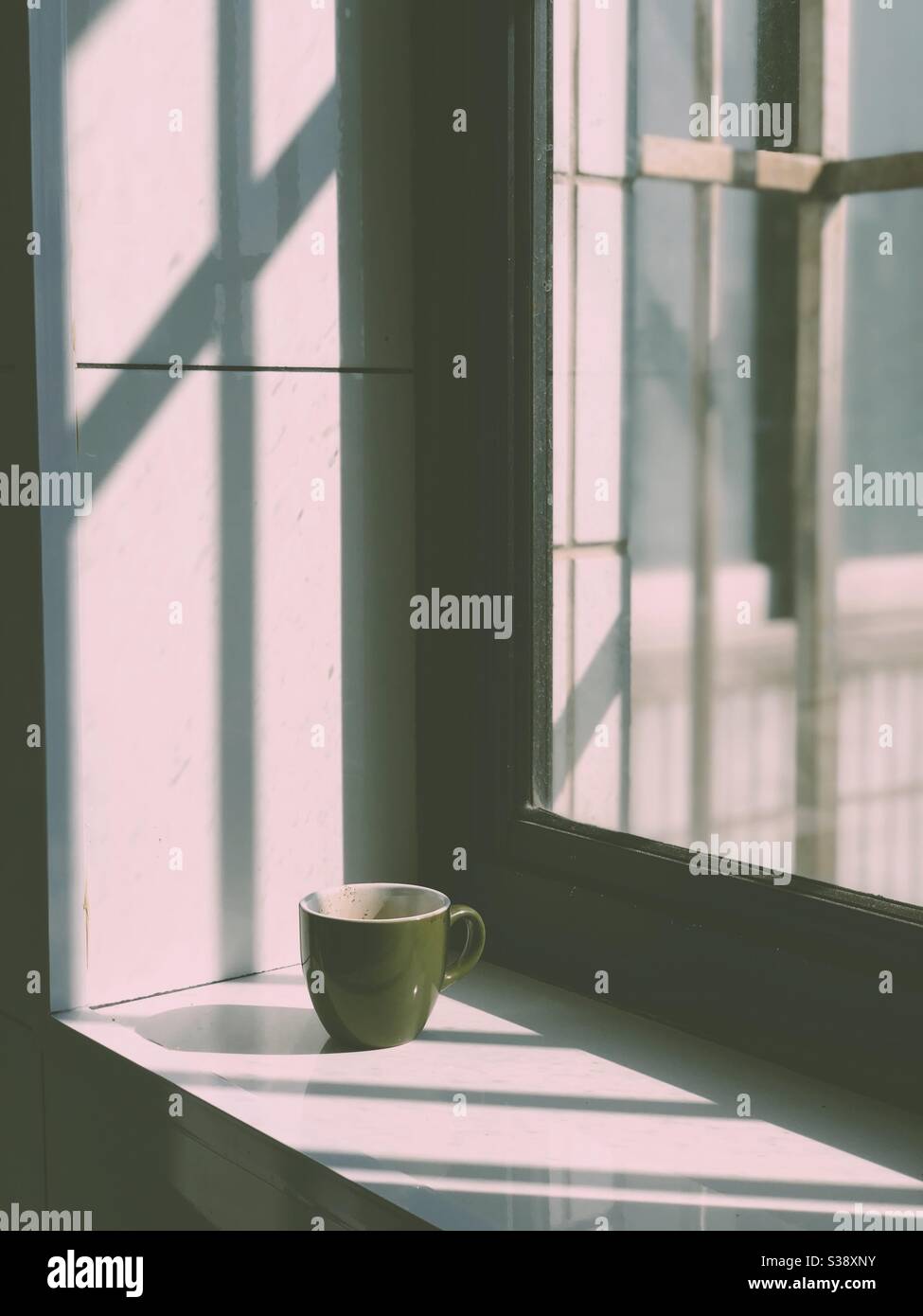 A coffee cup by the window Stock Photo - Alamy