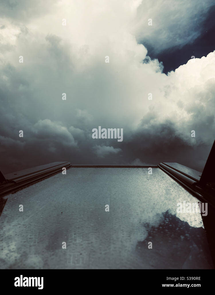 Storm Clouds through the window Stock Photo - Alamy