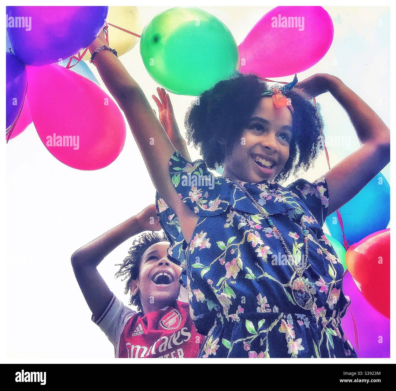 Children playing with balloons Stock Photo - Alamy