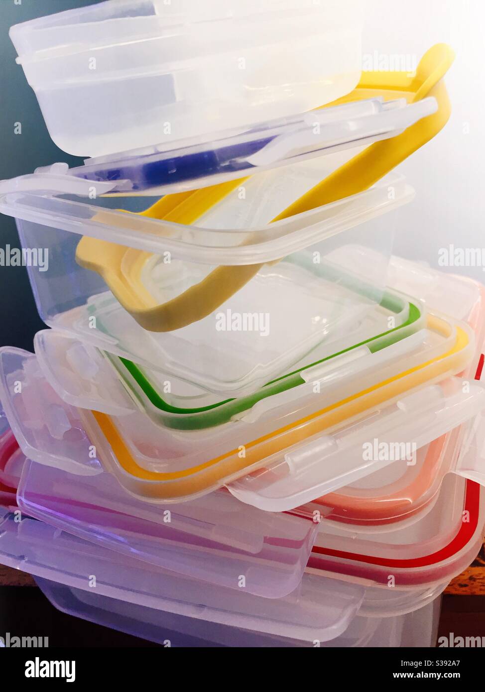 Containers with interlocking lids in a stack Stock Photo - Alamy