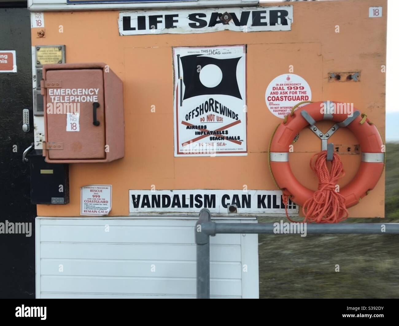 Life saver board emergency phone & life ring Stock Photo - Alamy