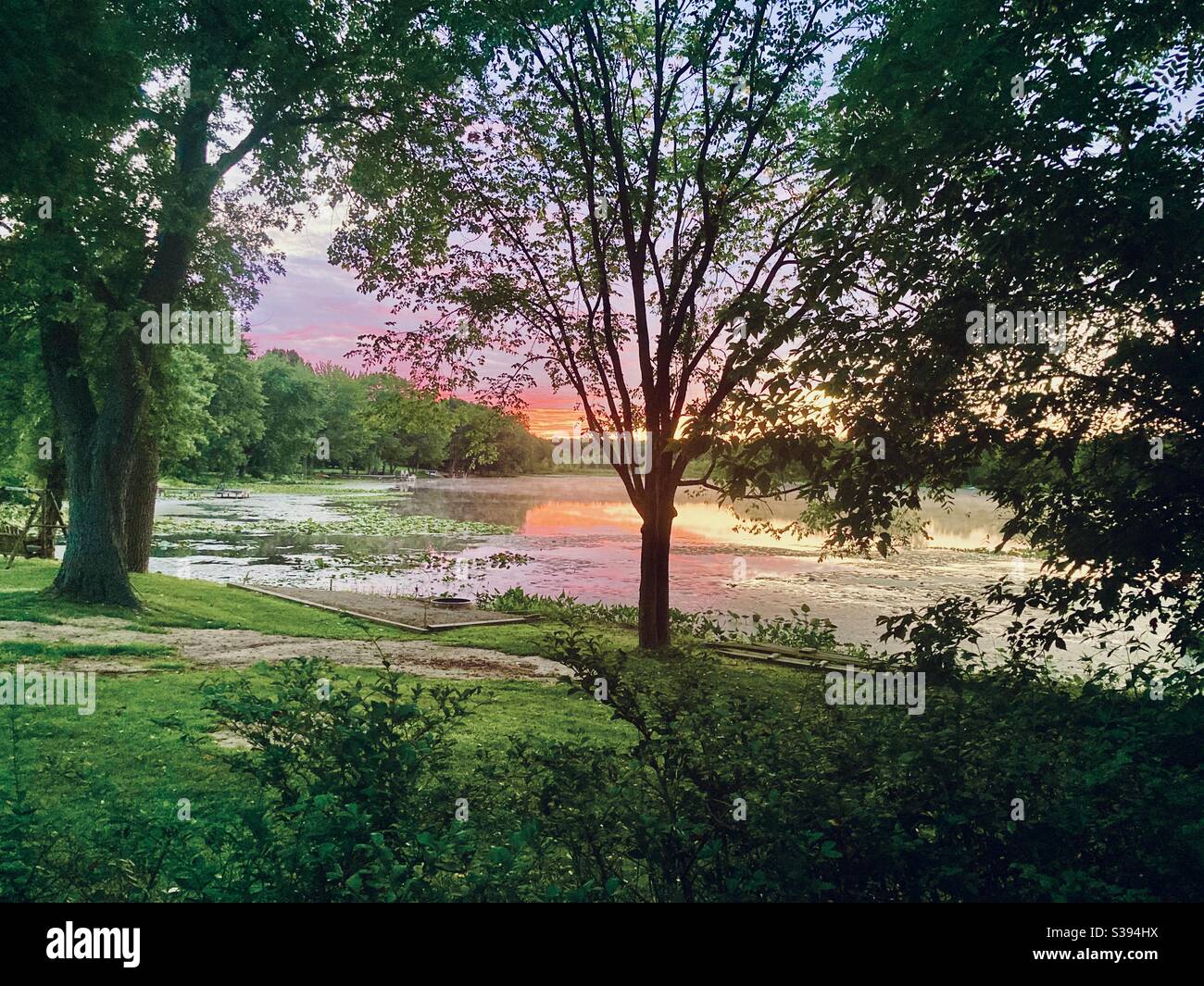 Sunrise over lake Stock Photo - Alamy