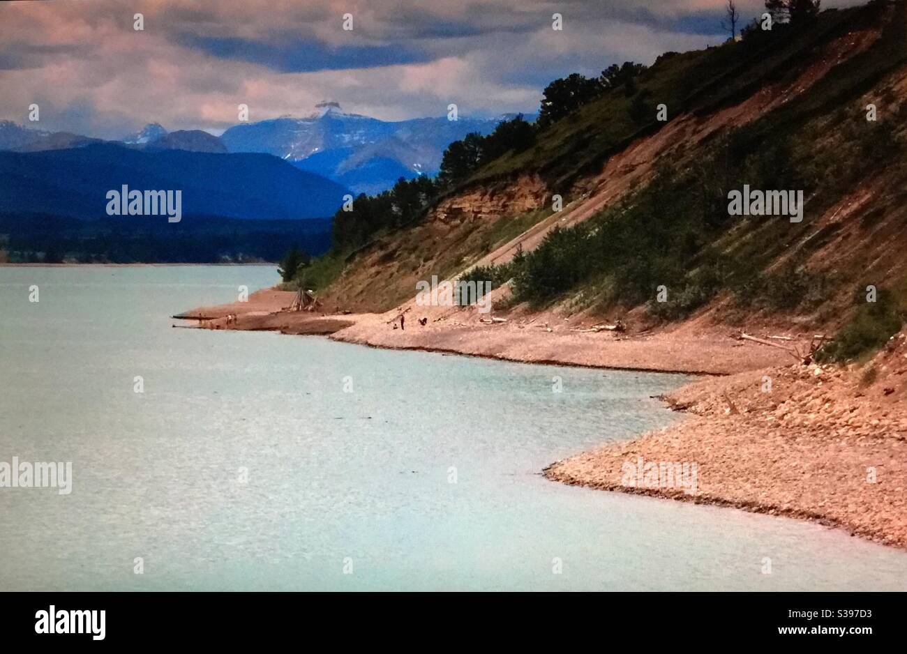 On the shores of Ghost Lake, a mountain lake in Kananaskis Country ...