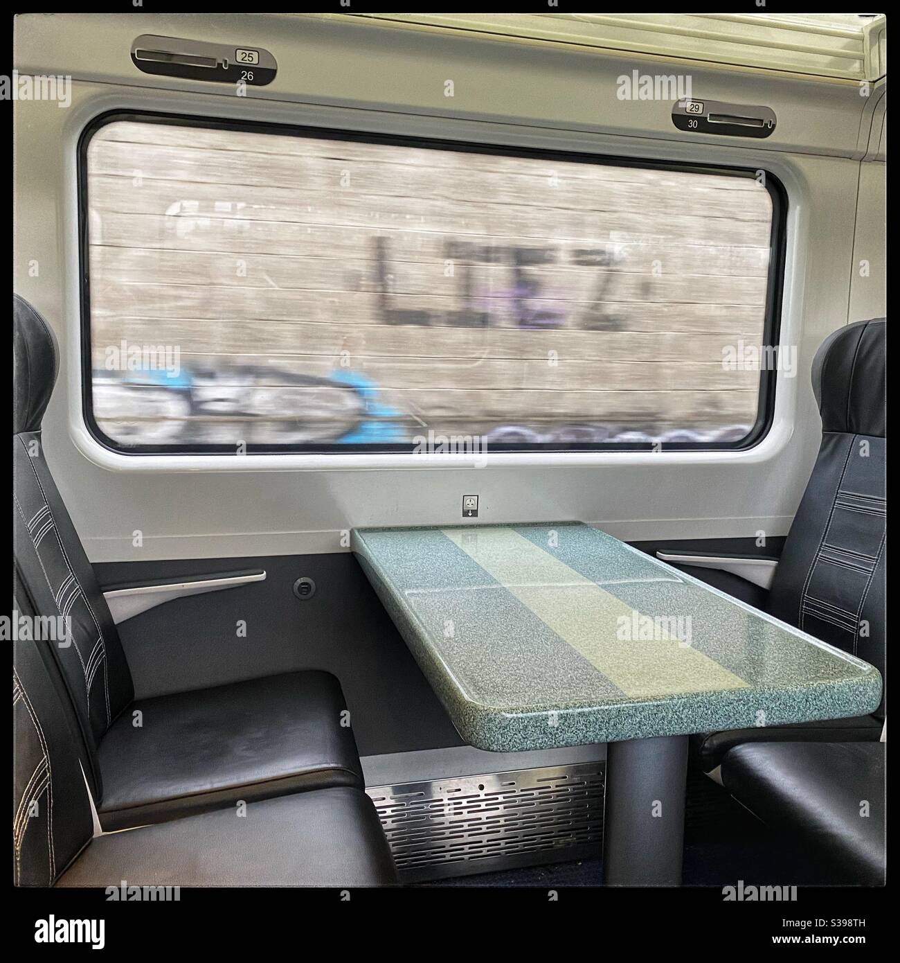 Graffiti seen through window of a moving train Stock Photo - Alamy