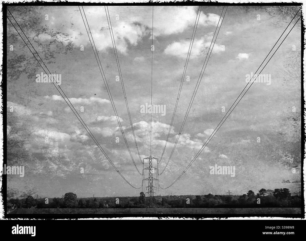 Black and white photograph of Pylon and electricity wires spreading ...