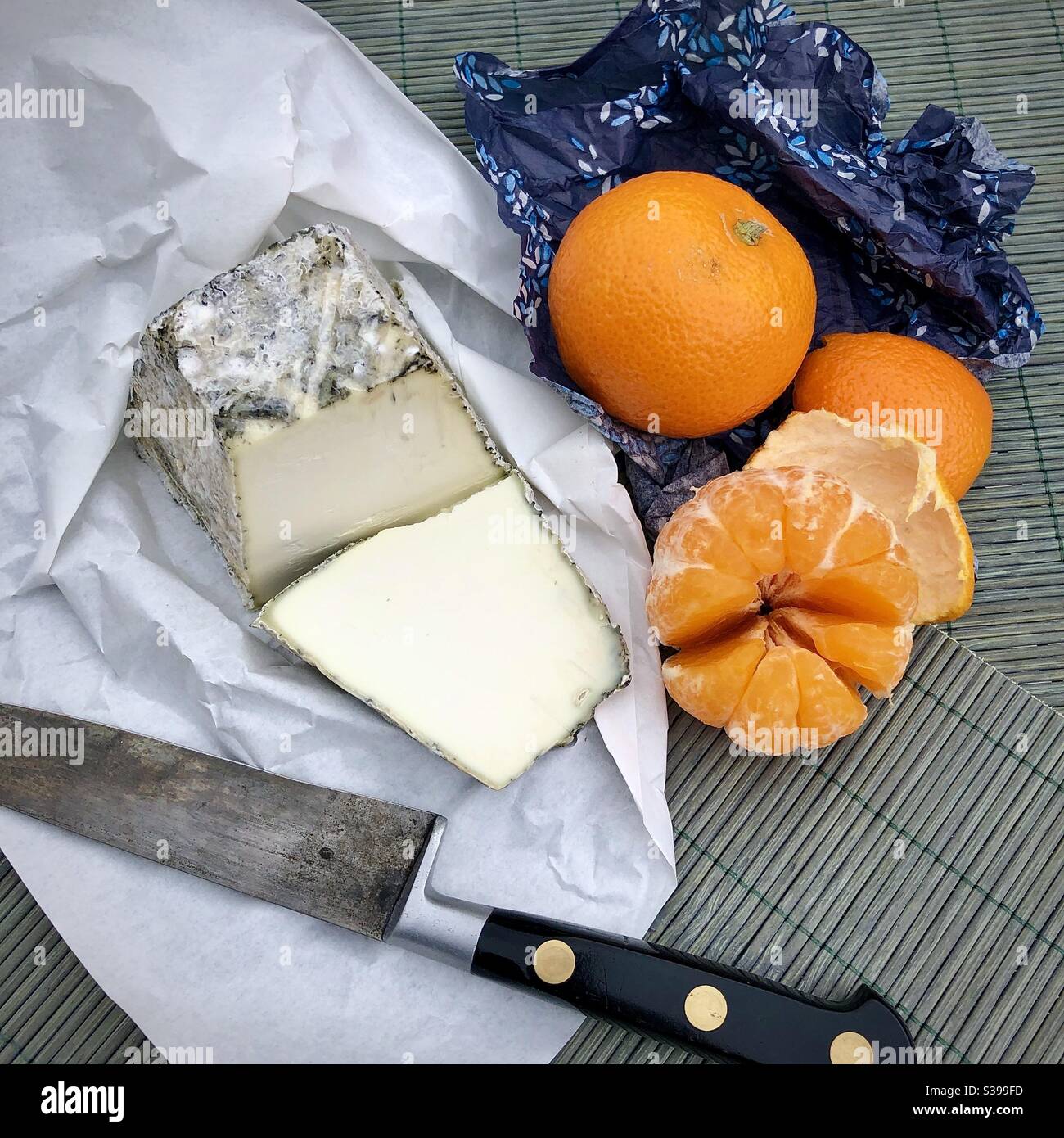 French pyramid shaped goat’s cheese and citrus fruit Stock Photo - Alamy