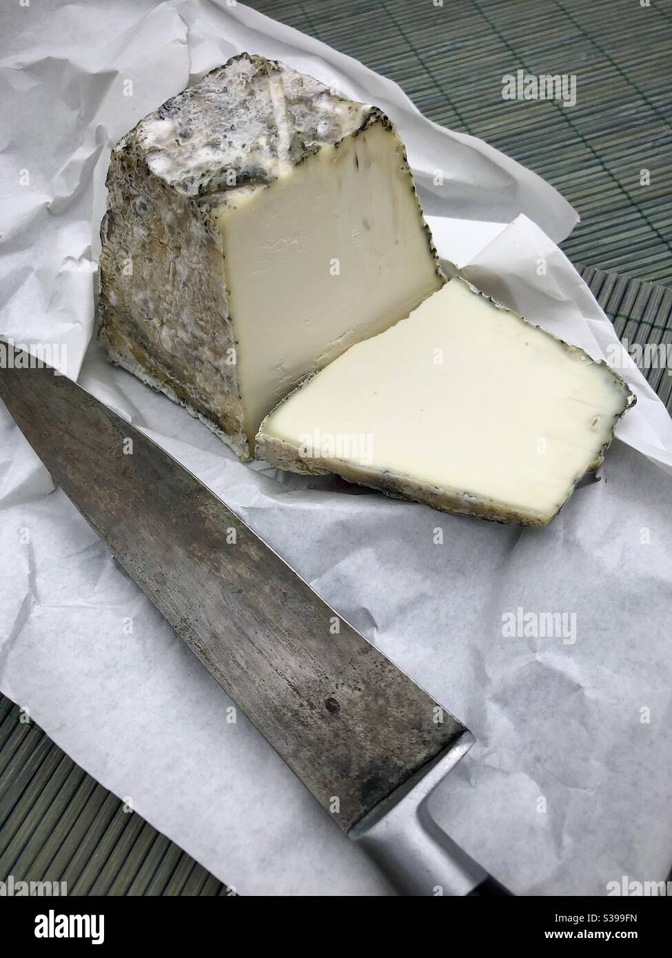 Slice of French pyramid shaped goat’s cheese Stock Photo - Alamy