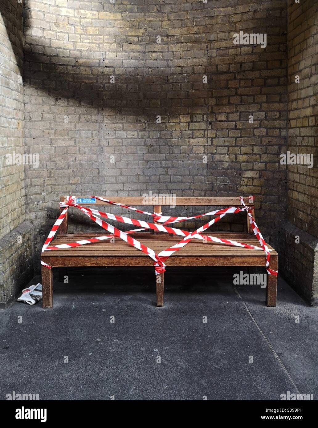 Wooden bench in London Underground station taped closed for Lockdown ...