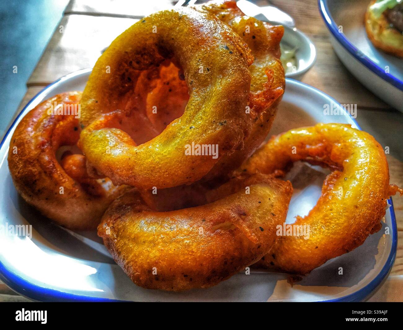 Tin Dish with Beer Battered Onion Rings in Stock Photo - Alamy
