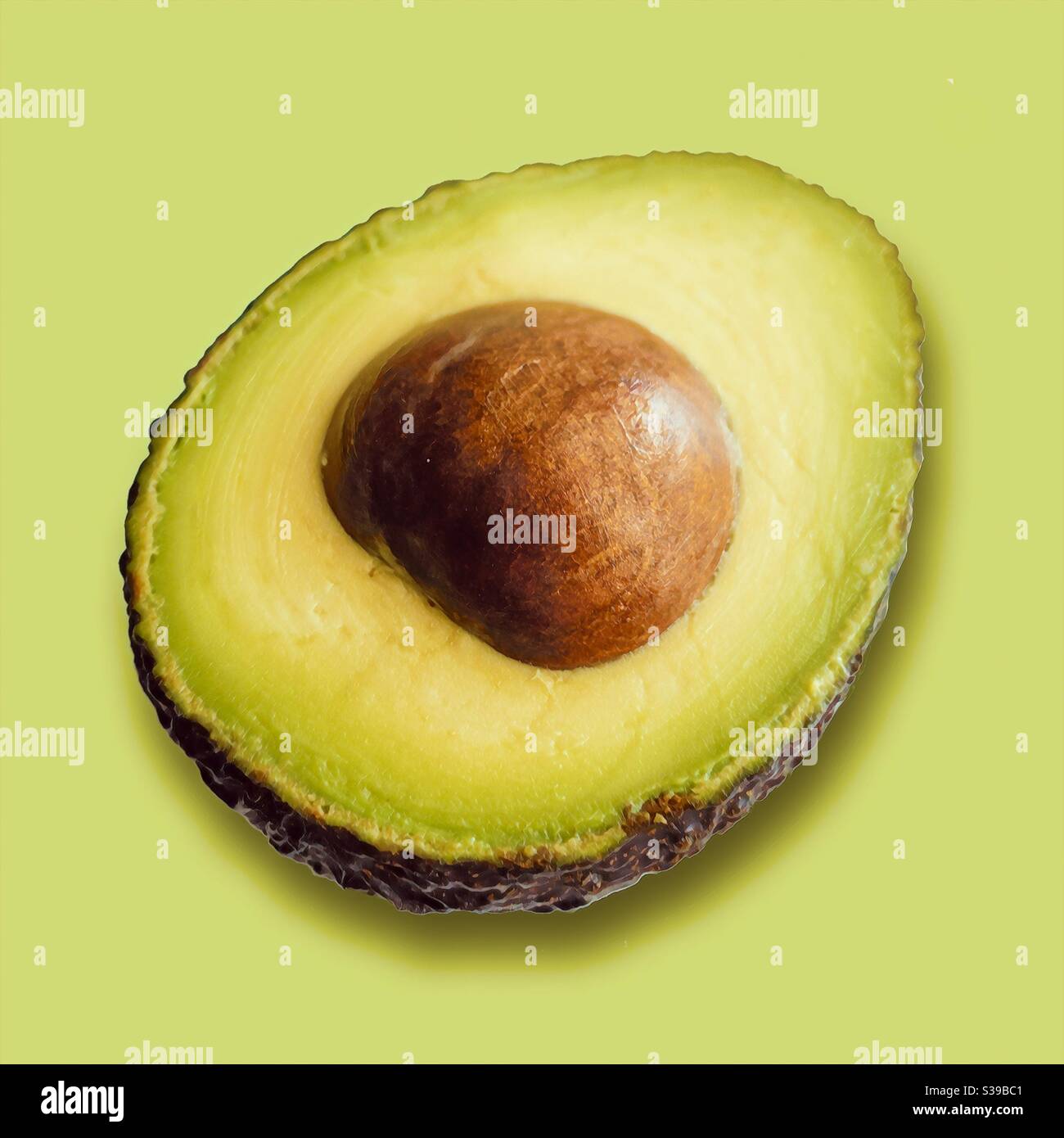 Avocado halve. Half an avocado. Avocado cut in half. Avocado stone ...