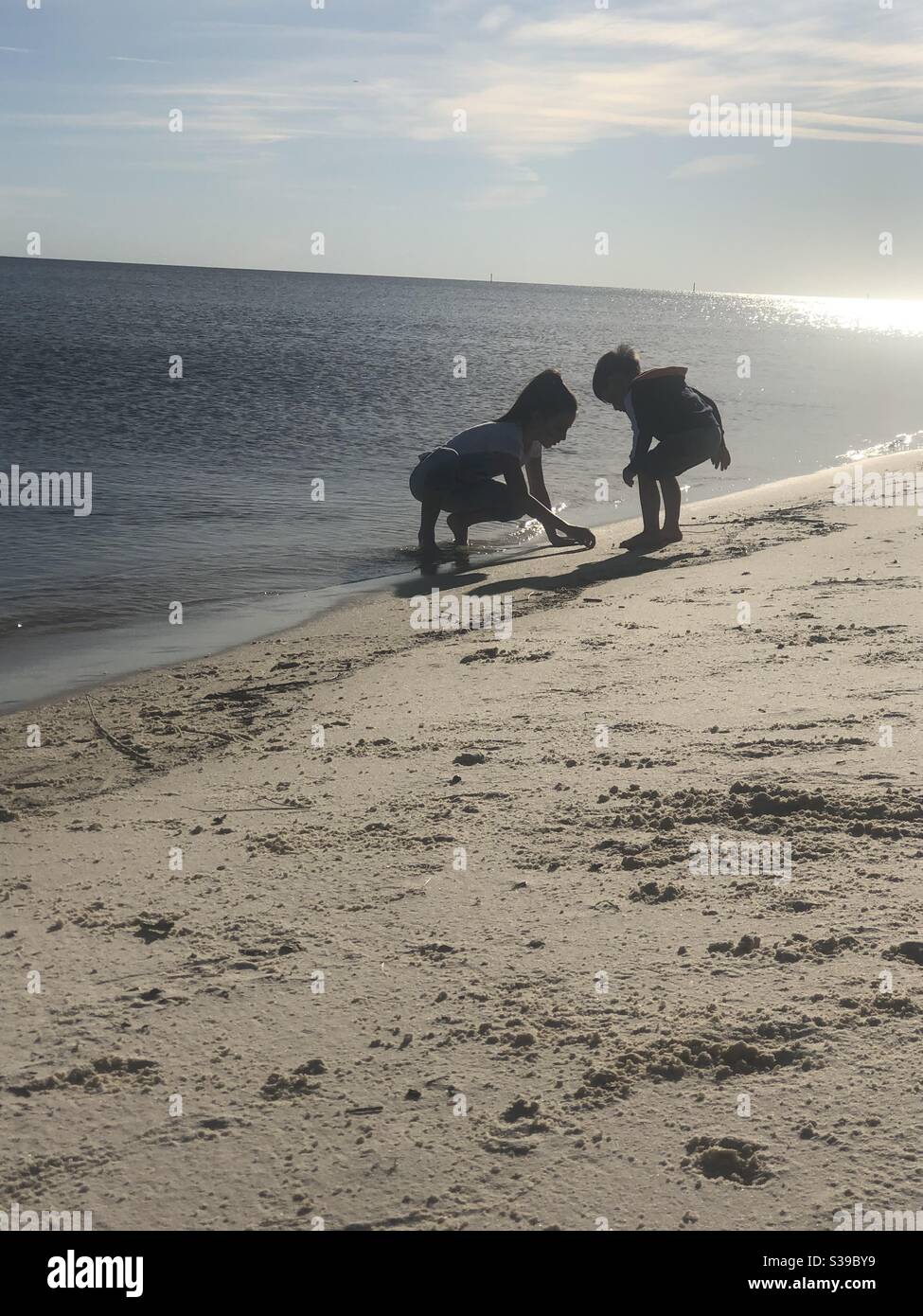 Kids bonding at beach Stock Photo - Alamy