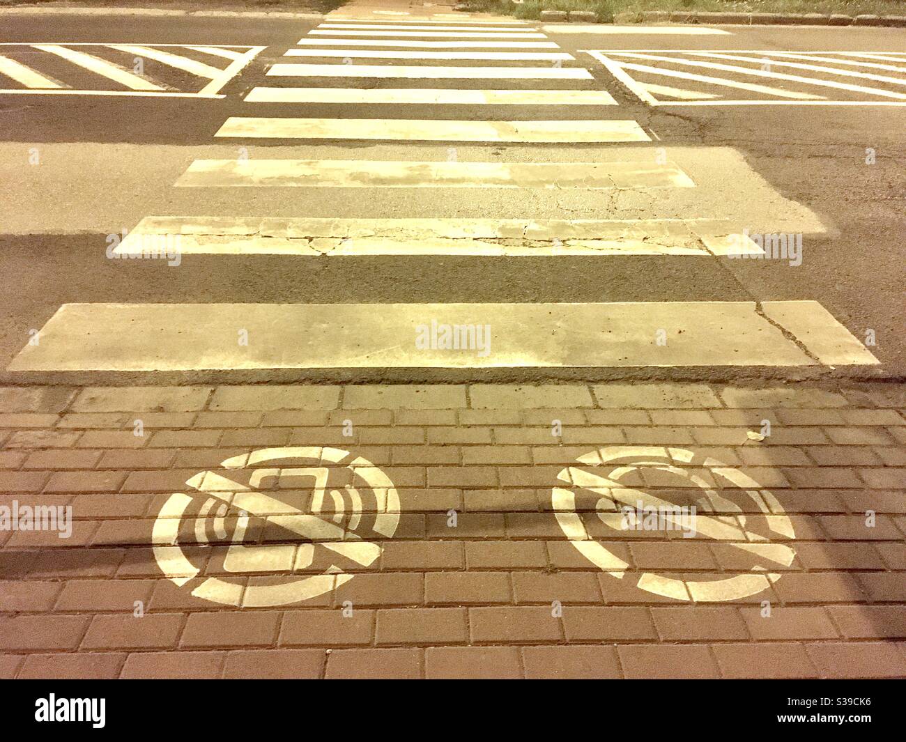 Do not use mobile phone or earphone while crossing the road signs ...