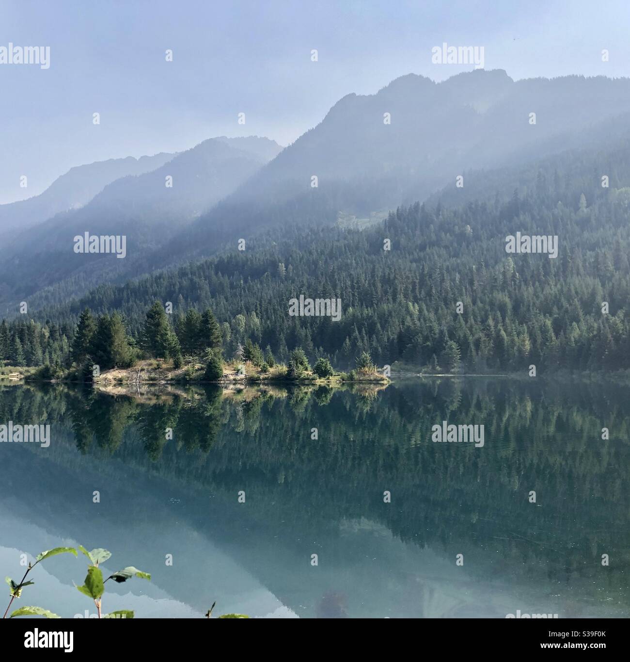 Reflections in an Alpine lake Stock Photo - Alamy