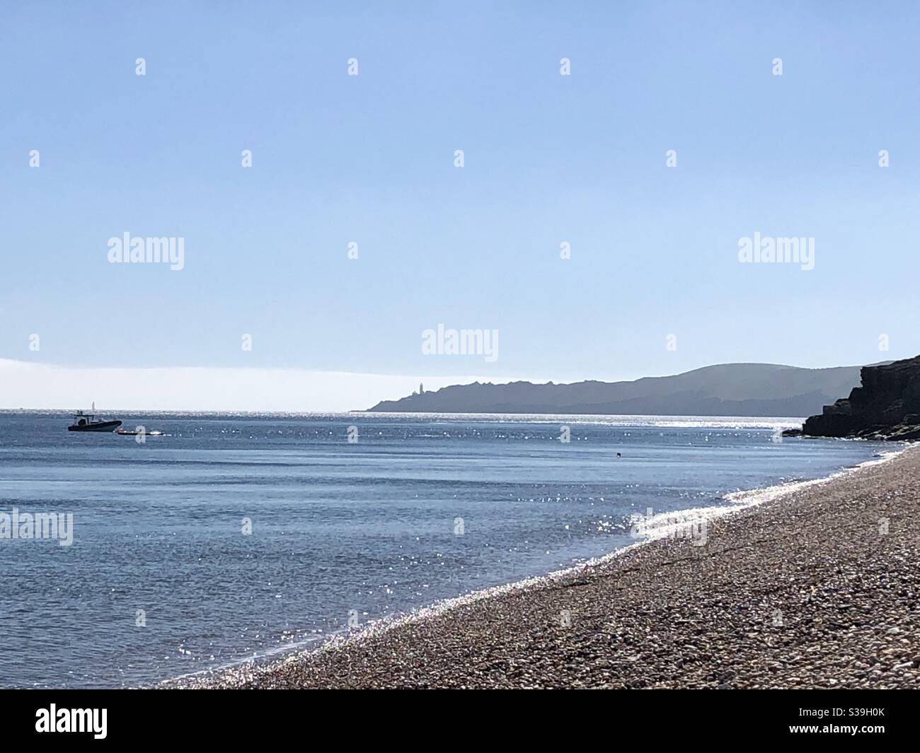 Torcross Beach with Start Bay and Start Point Lighthouse in the ...