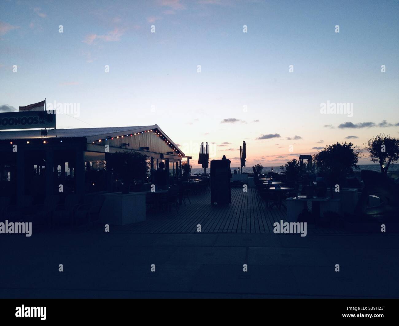 Beach house with sunset Stock Photo - Alamy