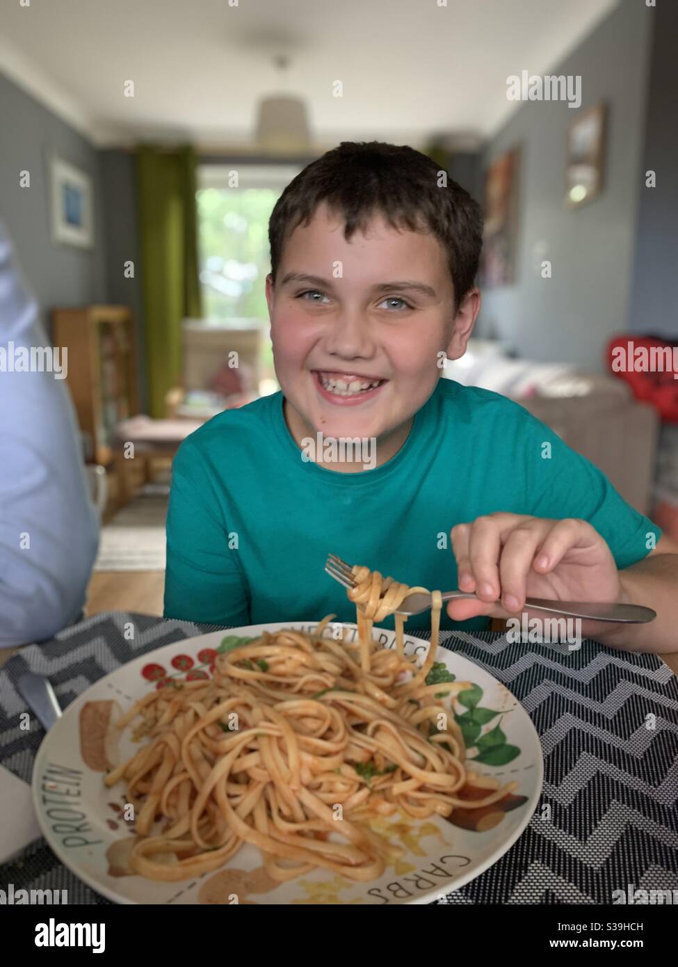 Boy eating pasta hi-res stock photography and images - Alamy