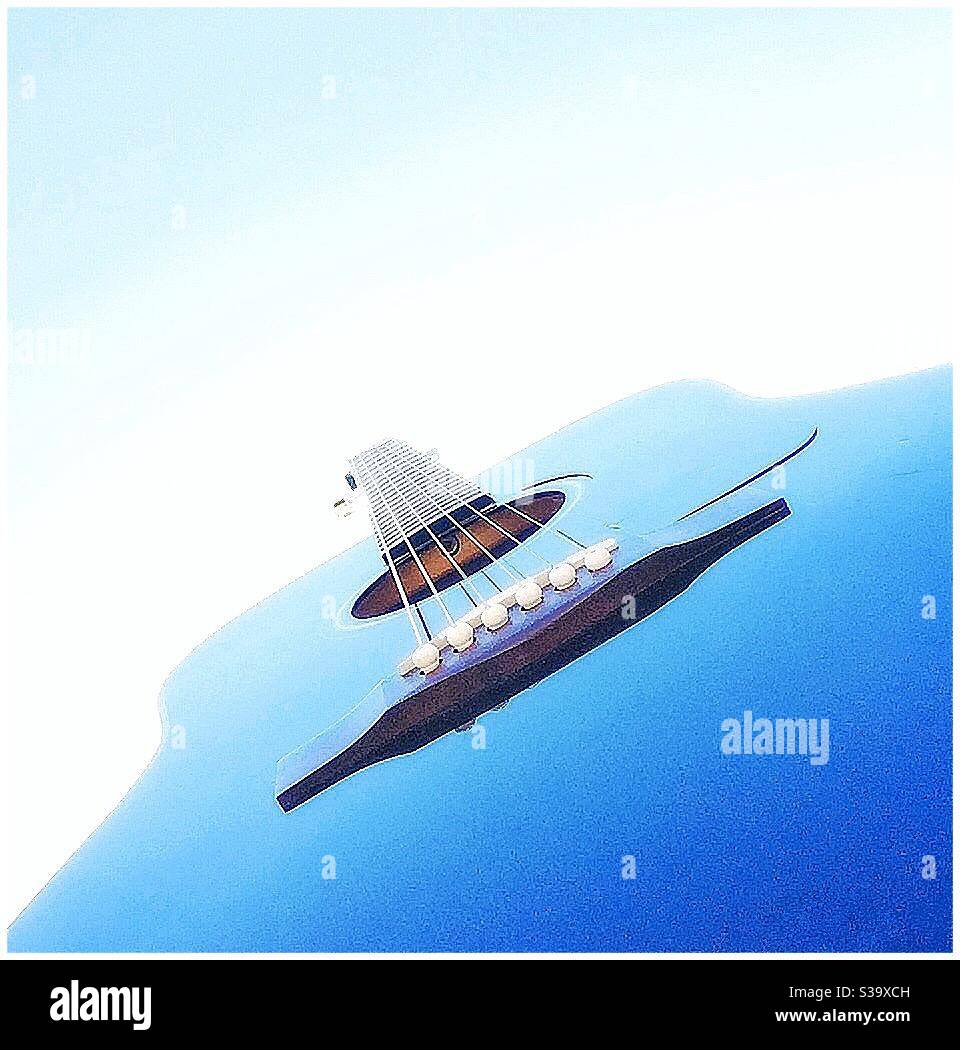 Blue acoustic guitar Stock Photo - Alamy