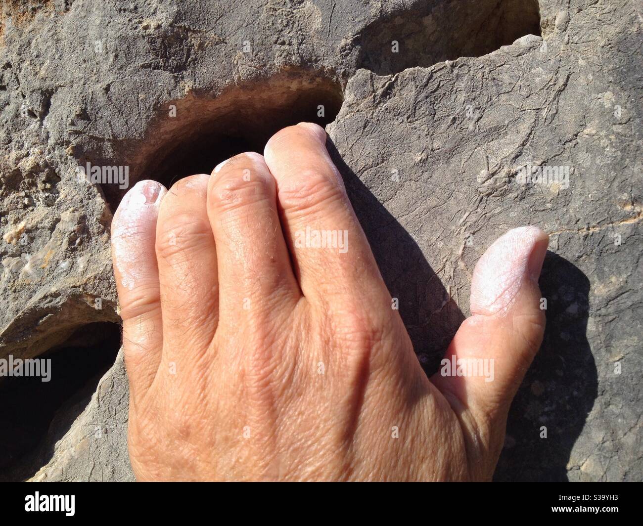 Hand of a climber on the rock Stock Photo - Alamy