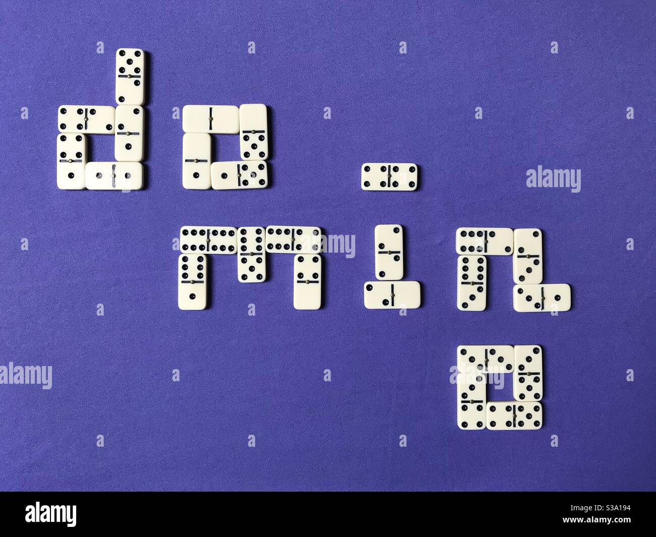 The Word “domino” Composed of Domino Tiles Stock Photo - Alamy