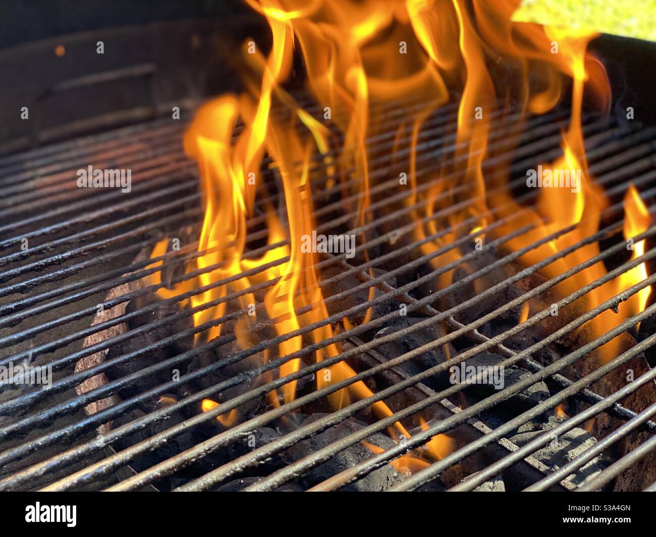 Flames on an outdoor BBQ grill Stock Photo - Alamy