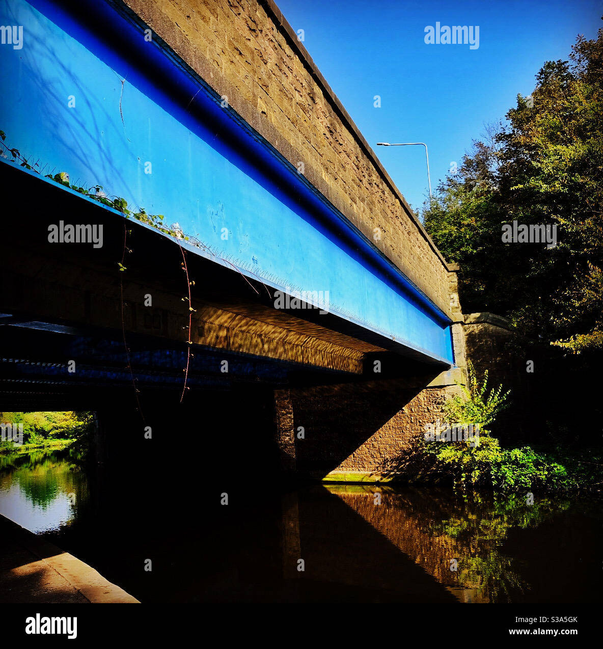 Blue Bridge On The Canal Stock Photo - Alamy