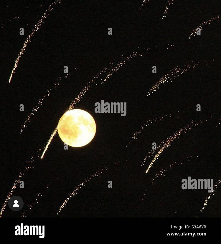 Fireworks on a full moon Stock Photo - Alamy