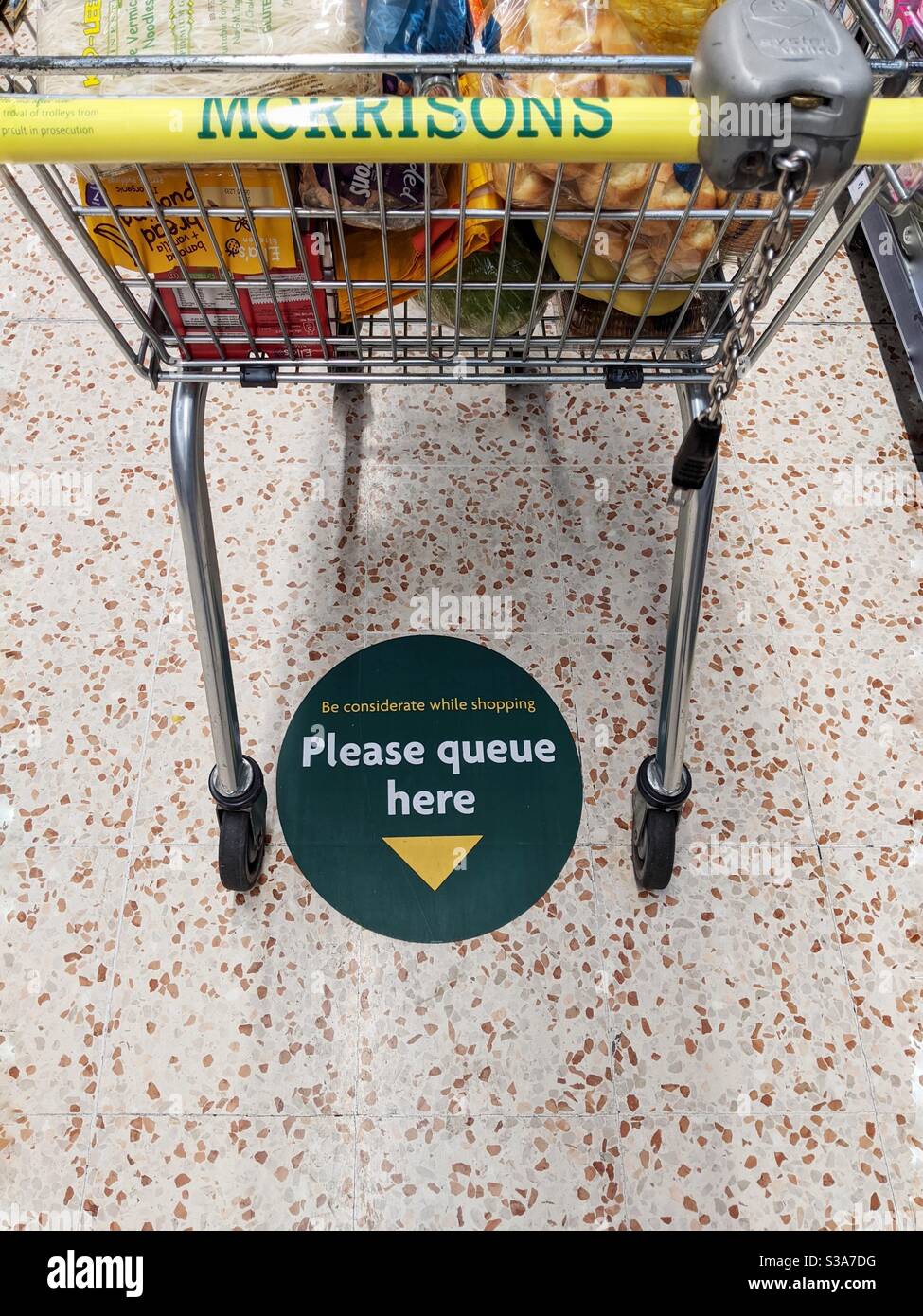 Social distancing markers on shop floor hi-res stock photography and ...