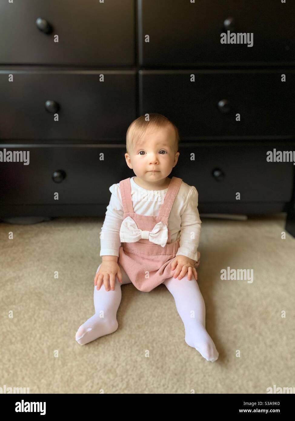 Baby with bow hi-res stock photography and images - Alamy