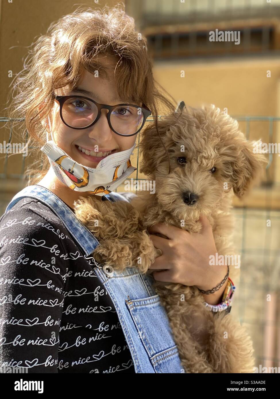 Teen girl with her cute poodle dog Stock Photo - Alamy