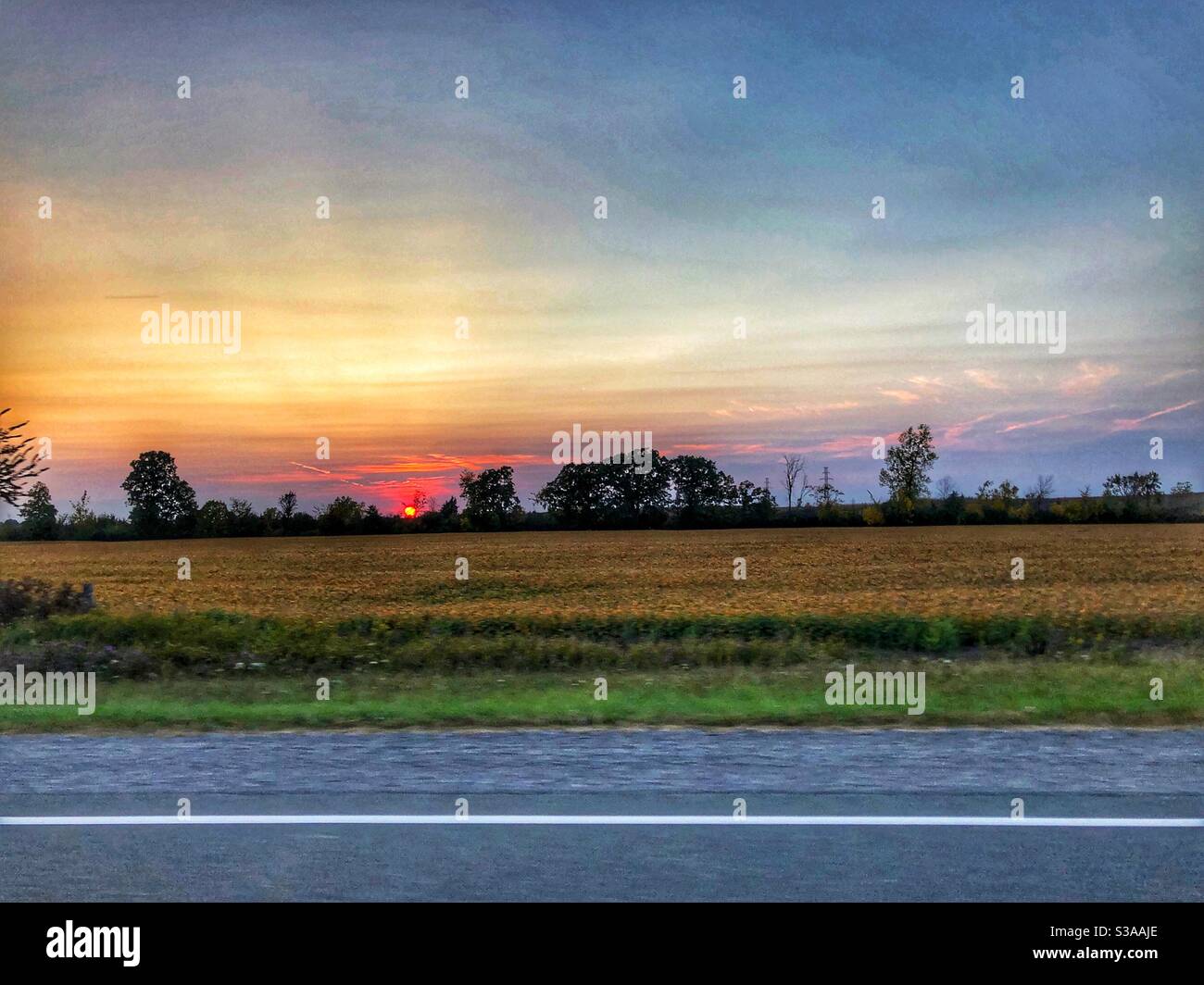 A warm sunset glow over the horizon Stock Photo - Alamy