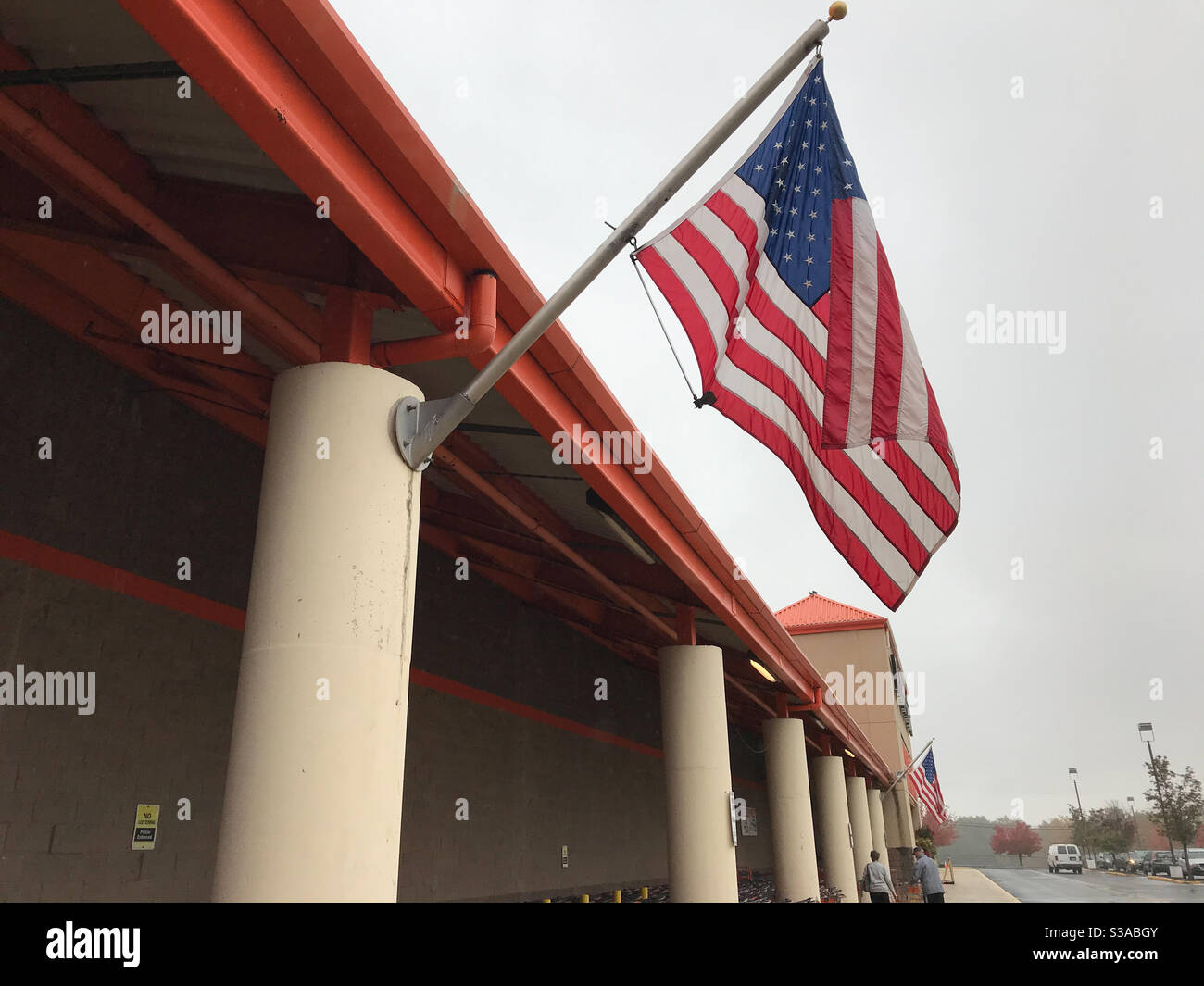 American flag in front of hardware store in USA Stock Photo - Alamy