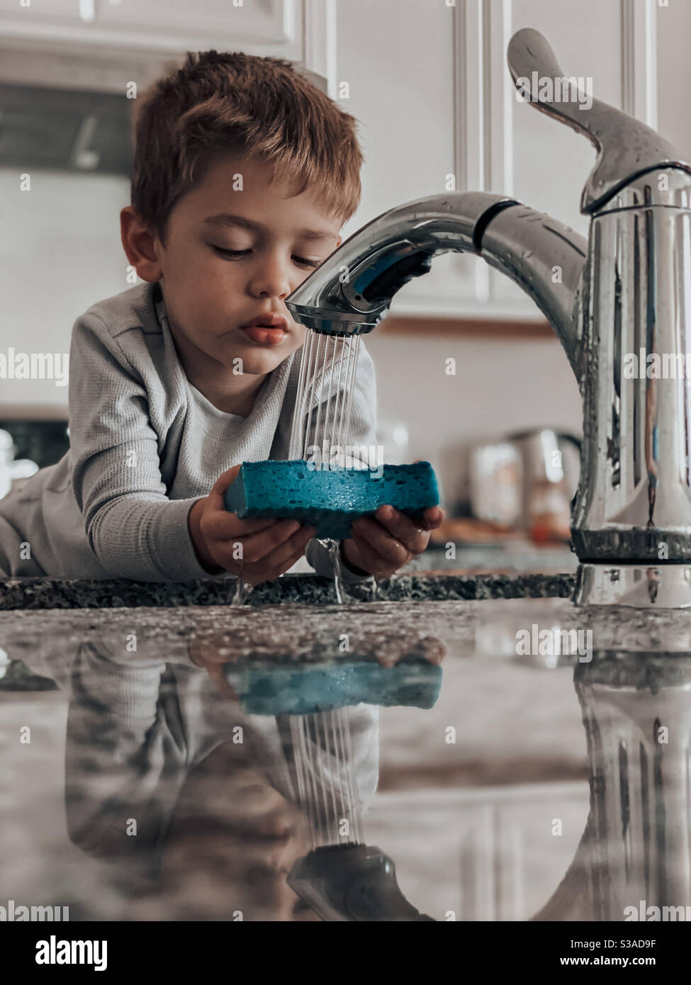 Boy Washing Dishes