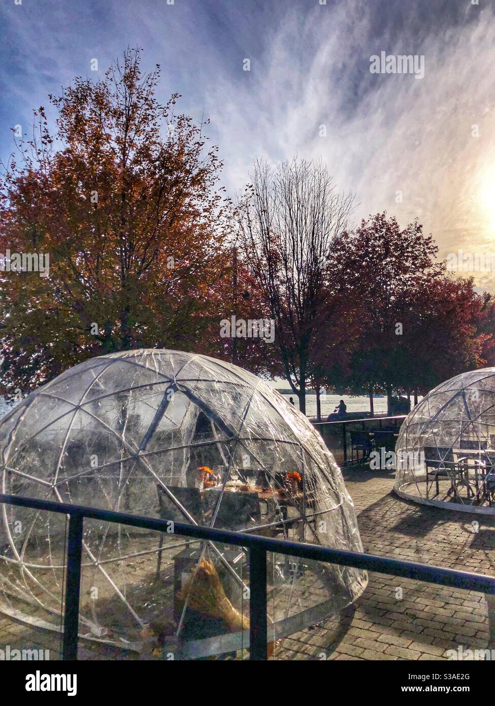 Plastic bubbles on an outdoor patio to provide protection during COVID ...