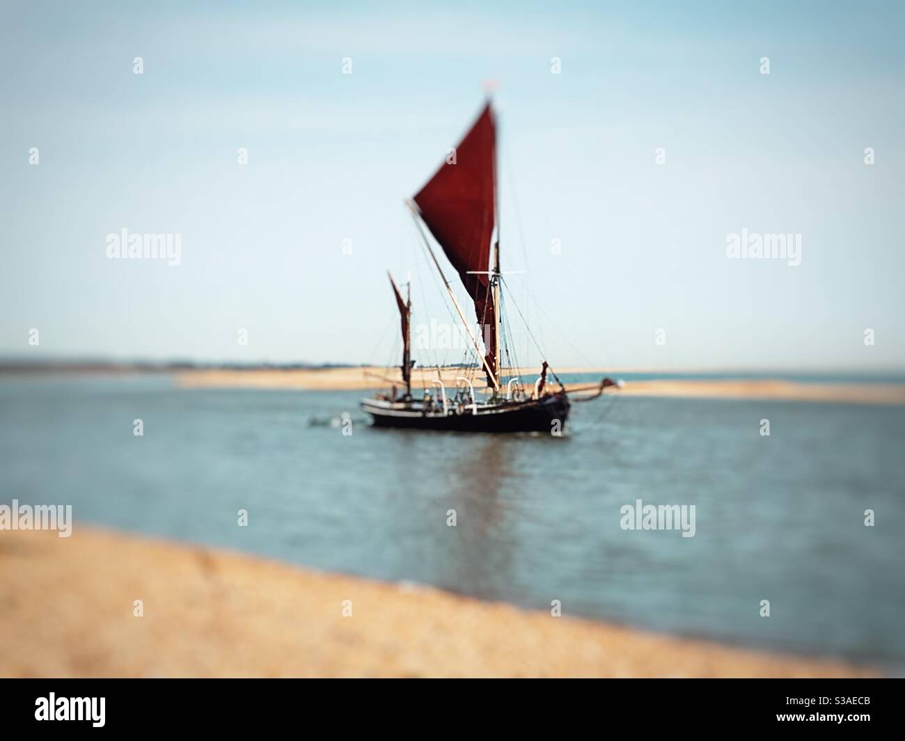 Vintage Thames barge sailing up the river Ore, Shingle Street, Suffolk ...