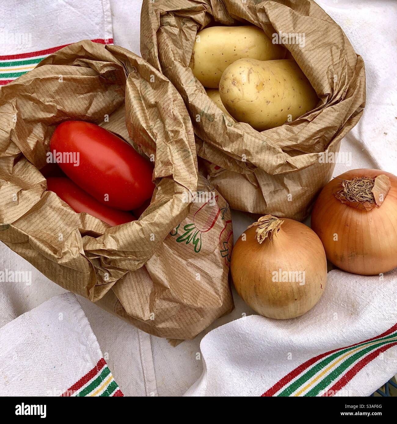 Staple vegetables- potatoes, tomatoes and onions Stock Photo - Alamy